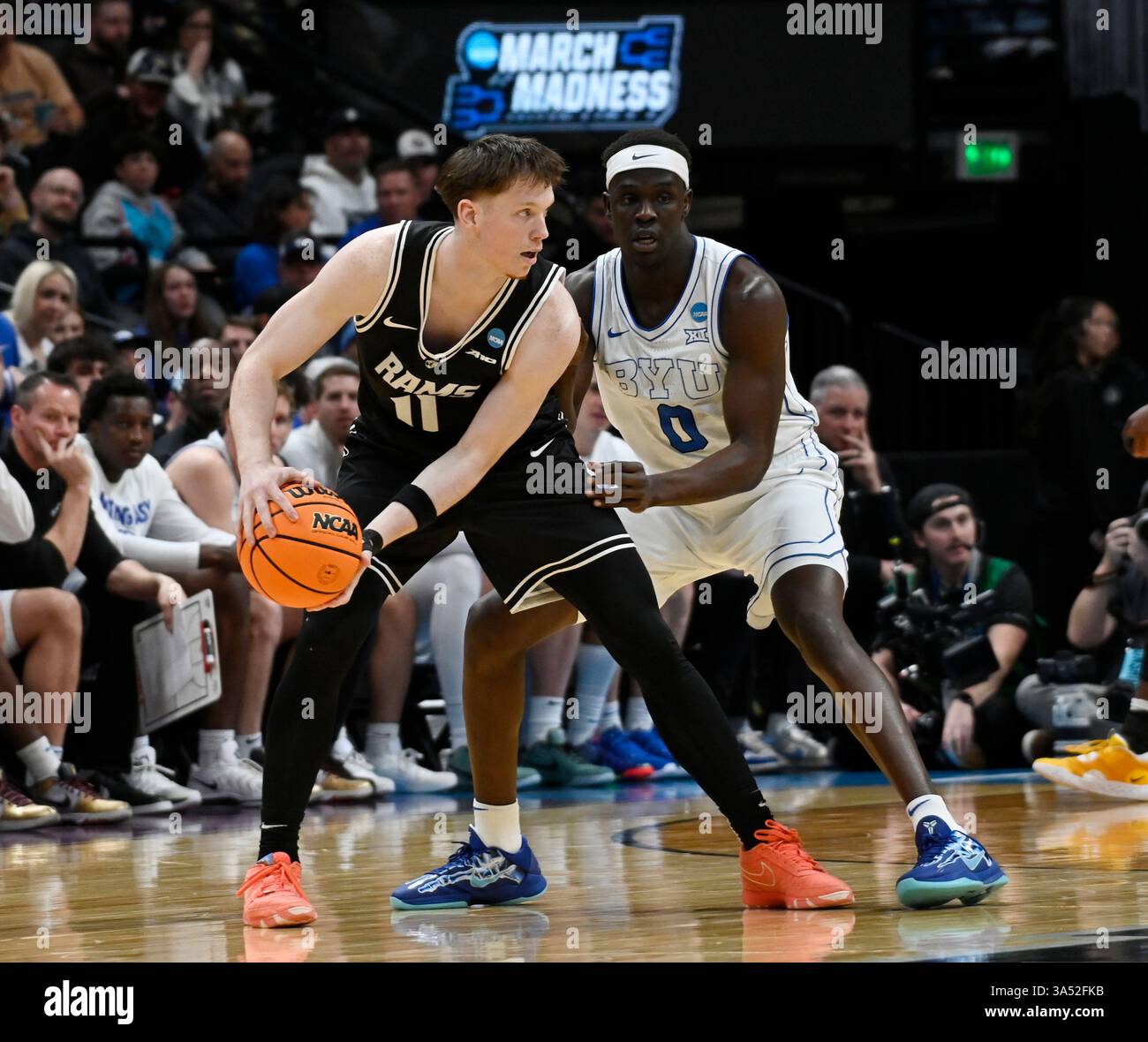 Virginia Commonwealth guard Max Shulga, left, looks to pass the ball as ...
