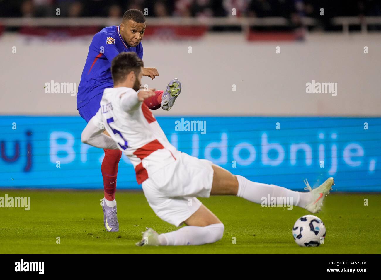 Croatia's Duje Caleta-Car tries to block a shot by France's Kylian ...
