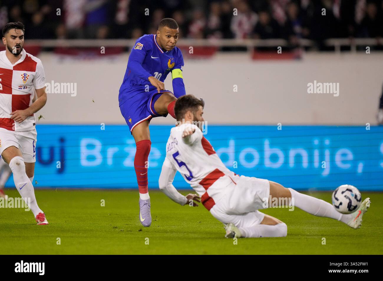 Croatia's Duje Caleta-Car tries to block a shot by France's Kylian ...
