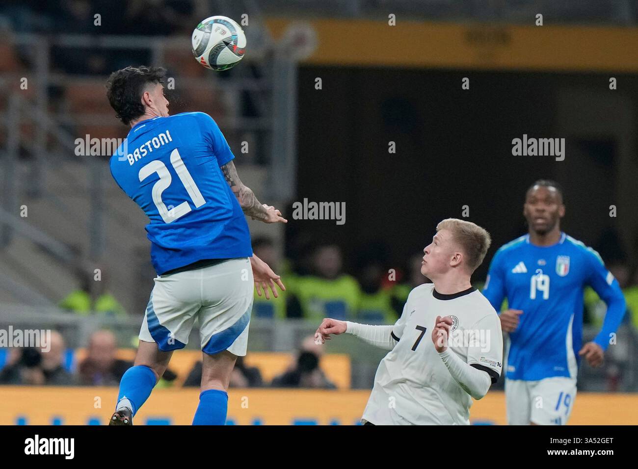 Italy's Alessandro Bastoni, left, heads the ball past Germany's ...