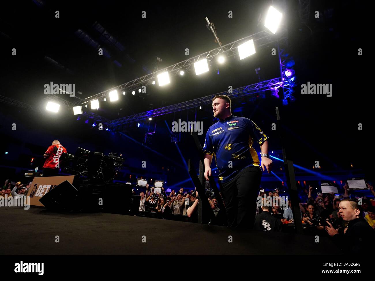 Luke Littler walks on stage to play Nathan Aspinall during night seven ...