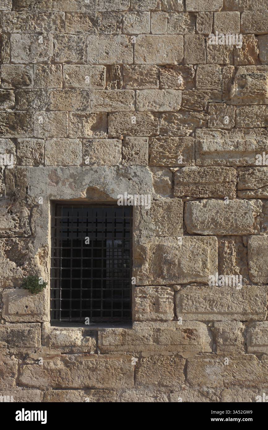 An ancient Crusader fortress. Large barred window Stock Photo - Alamy