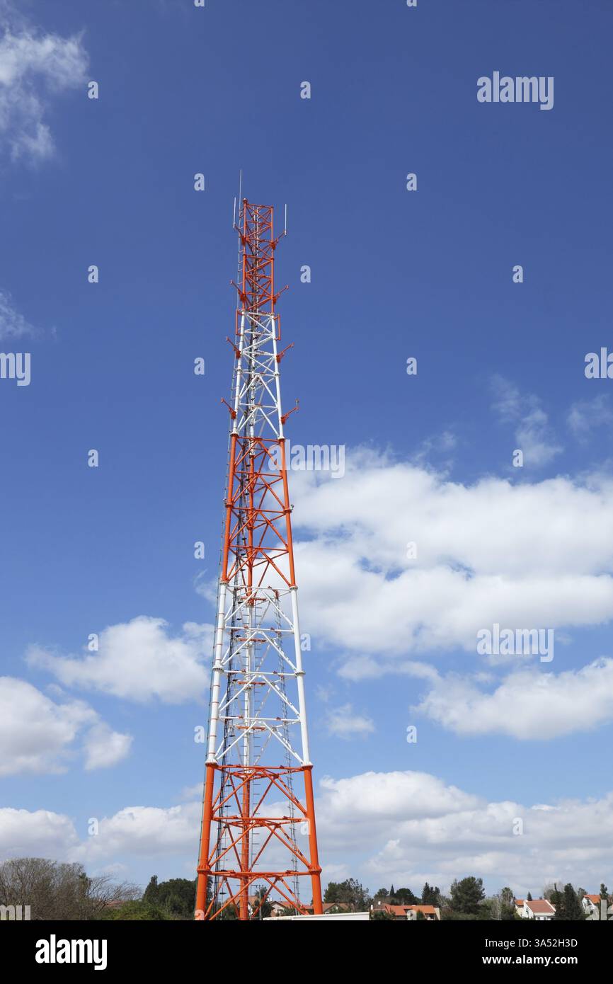 Aerial metallic red and white mast against the sky and clouds Stock ...