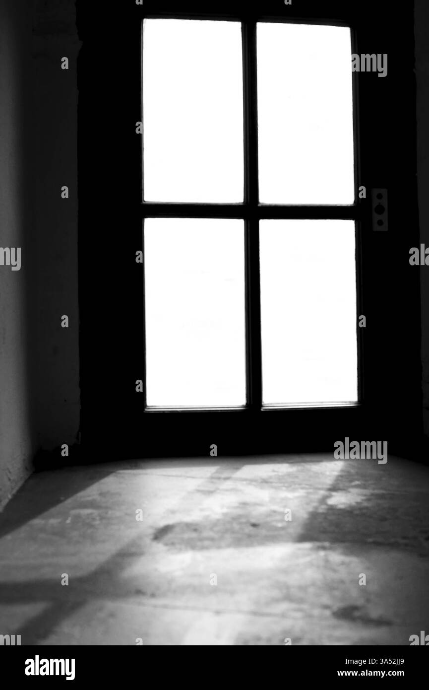 Incidence of light into the basement window Stock Photo - Alamy