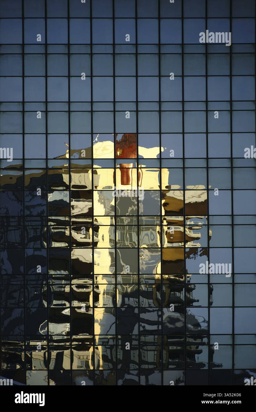 The abstract reflection of a residential building in the mirrored ...