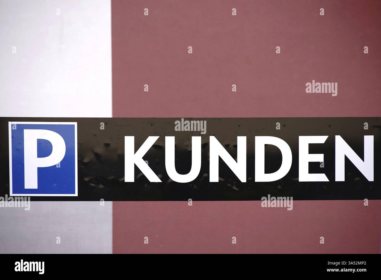 A parking sign for customers of a residential and commercial building ...