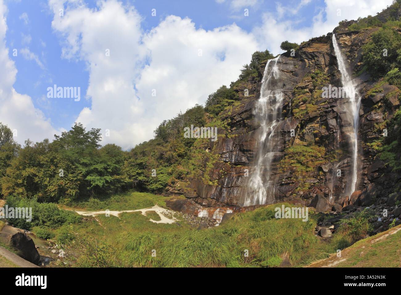 Double falls in mountains of northern Italy. Parallel streams of water ...