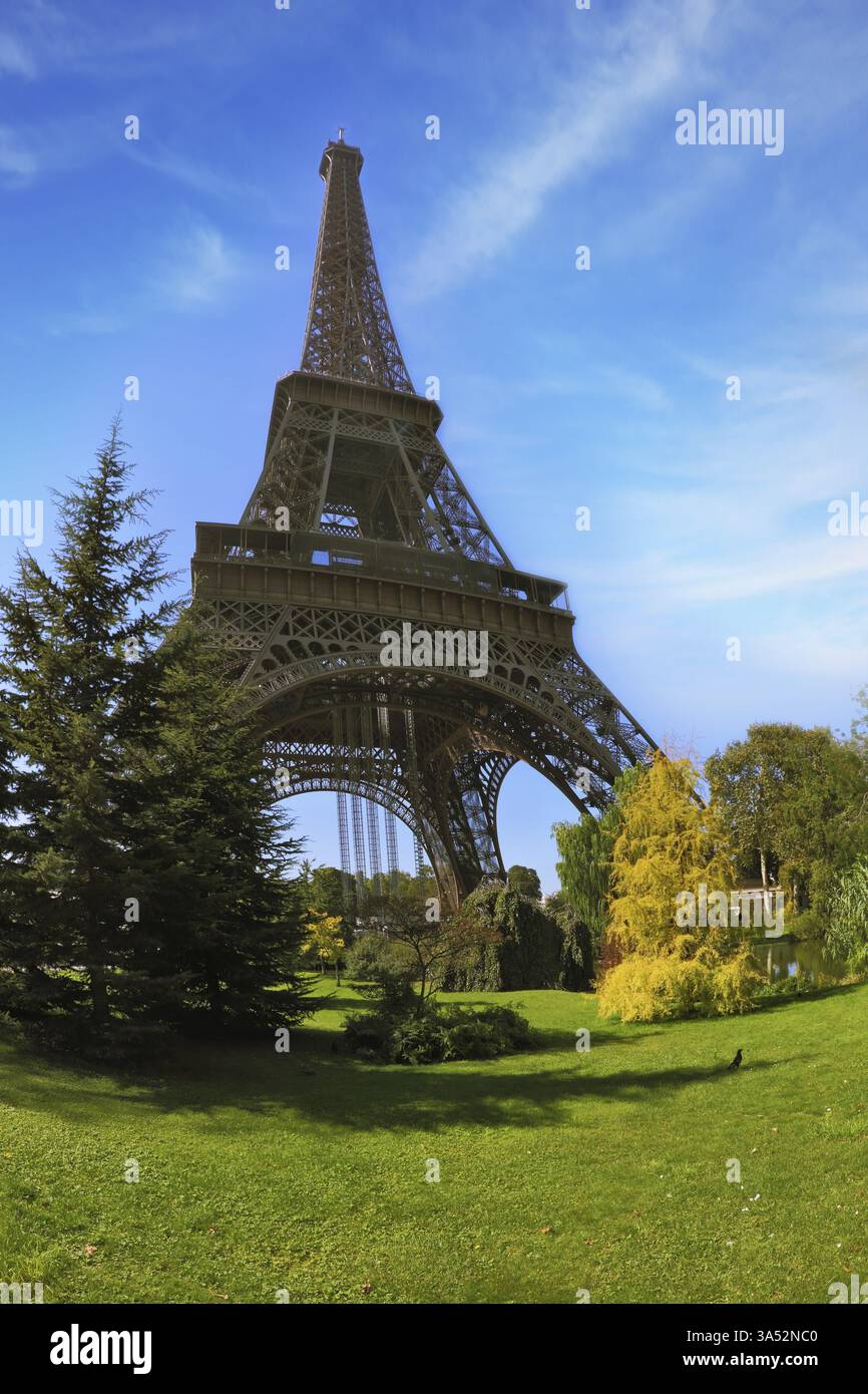 Travel Paris. Park at the foot of the Eiffel Tower. Unexpected angle ...