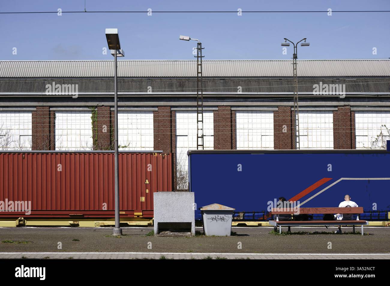 Railway wagons of a goods train standing at a platform of a freight ...