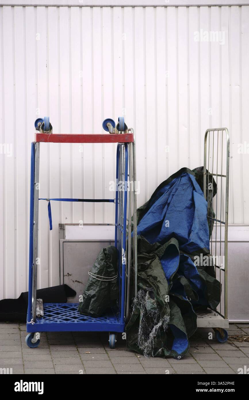 Trolley for transporting tools and materials with plastic tarpaulins ...