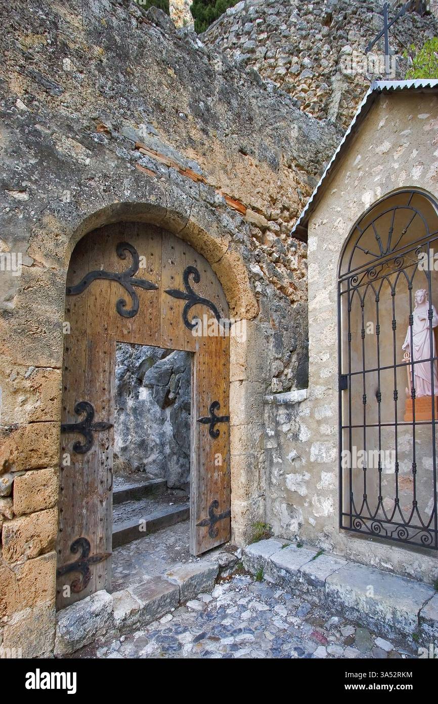 Ancient door, steps leaders in church, and the madonna Stock Photo - Alamy