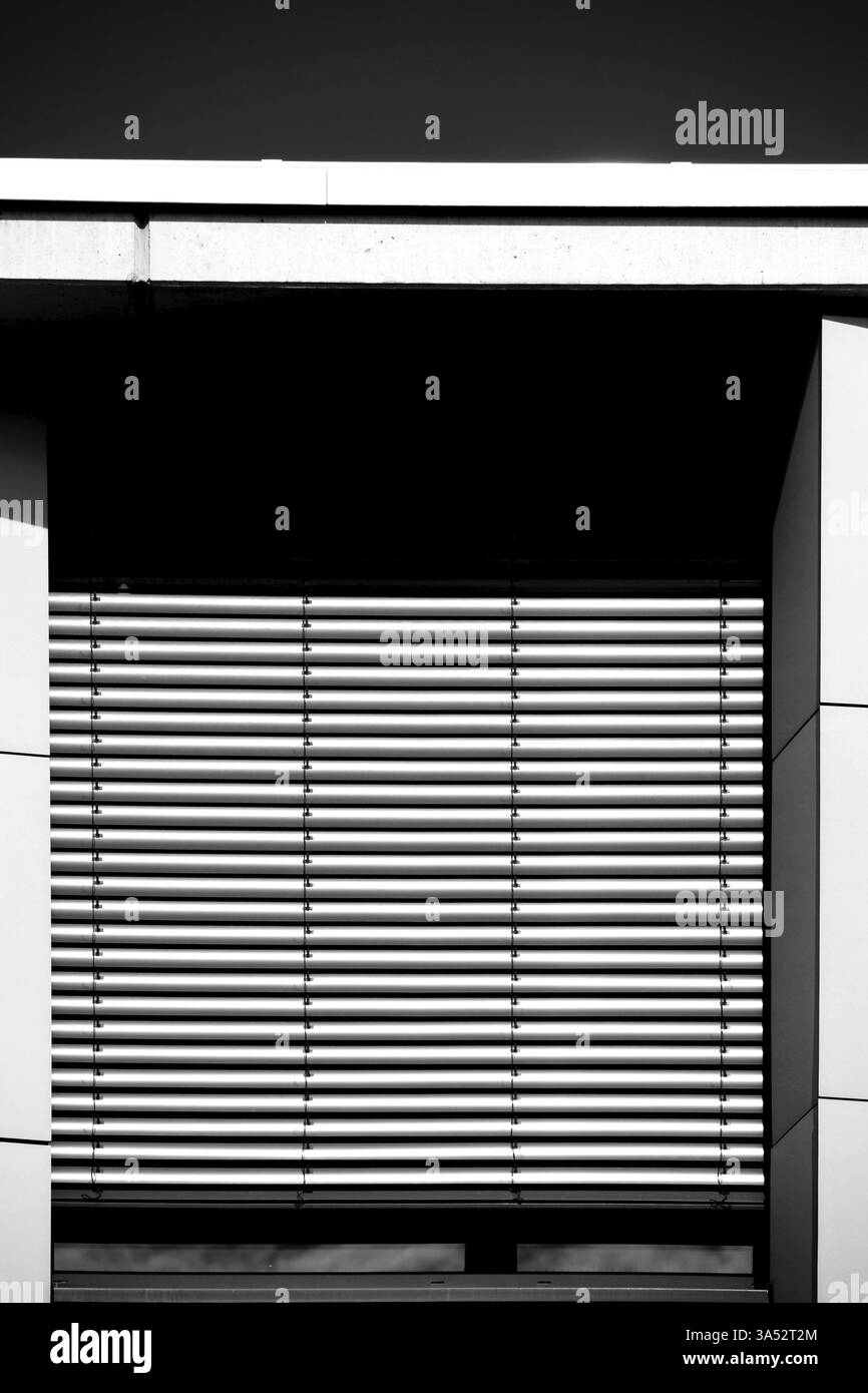 The modern facade of a modern residential building with a shiny metal ...