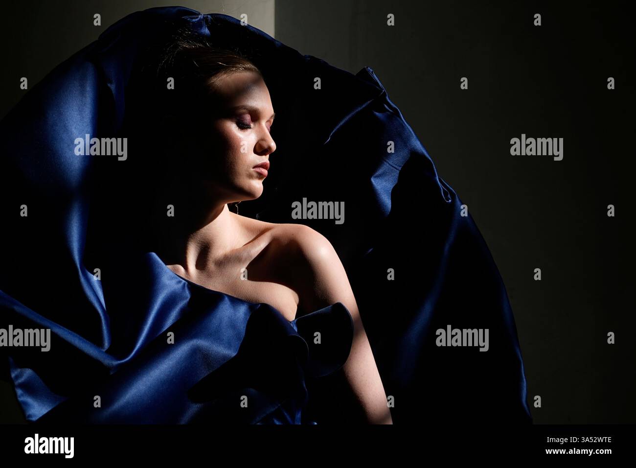 Sunlight illuminates a model backstage at Moscow Fashion Week in Moscow ...