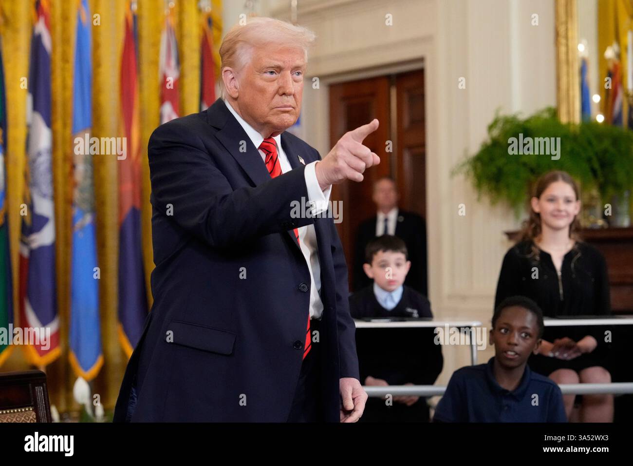 President Donald Trump gestures after signing executive order in the ...