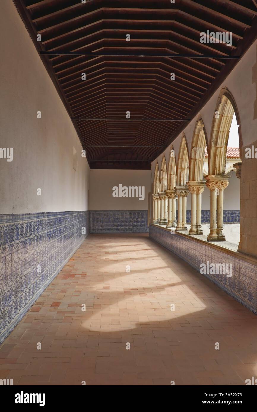 The magnificent medieval monastery in Portugal. Sunlit gallery ...