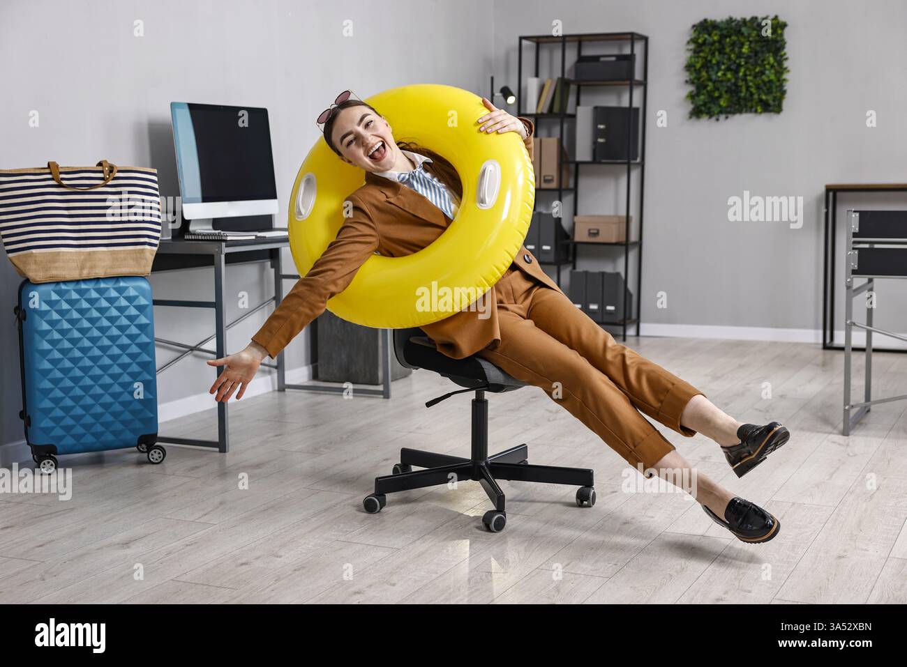 Office worker posing on chair hi-res stock photography and images - Alamy