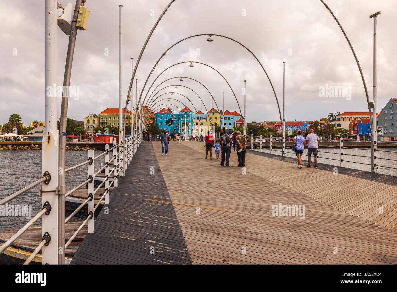 Queen Emma Bridge with pedestrians crossing St. Anna Bay in Willemstad ...