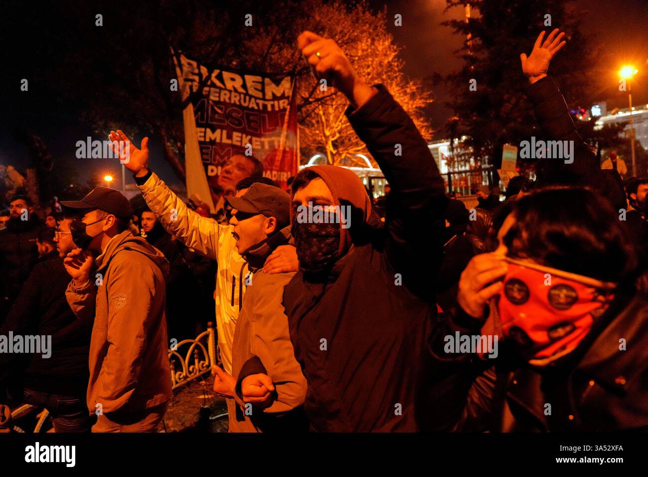 People shout slogans during clashes with anti riot police as they ...