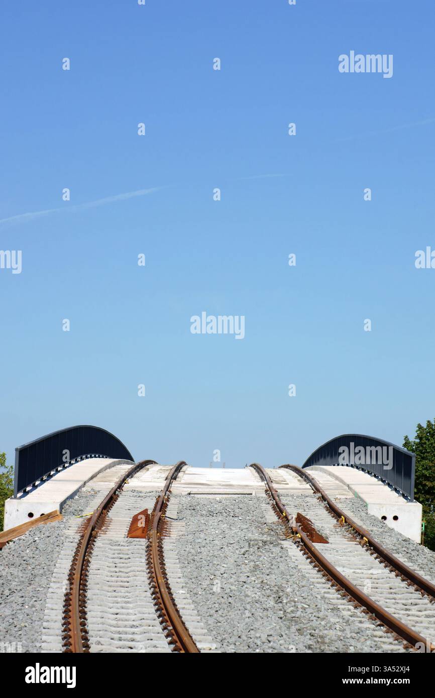 A newly built bridge and railway line for trams with rails, ballast and ...