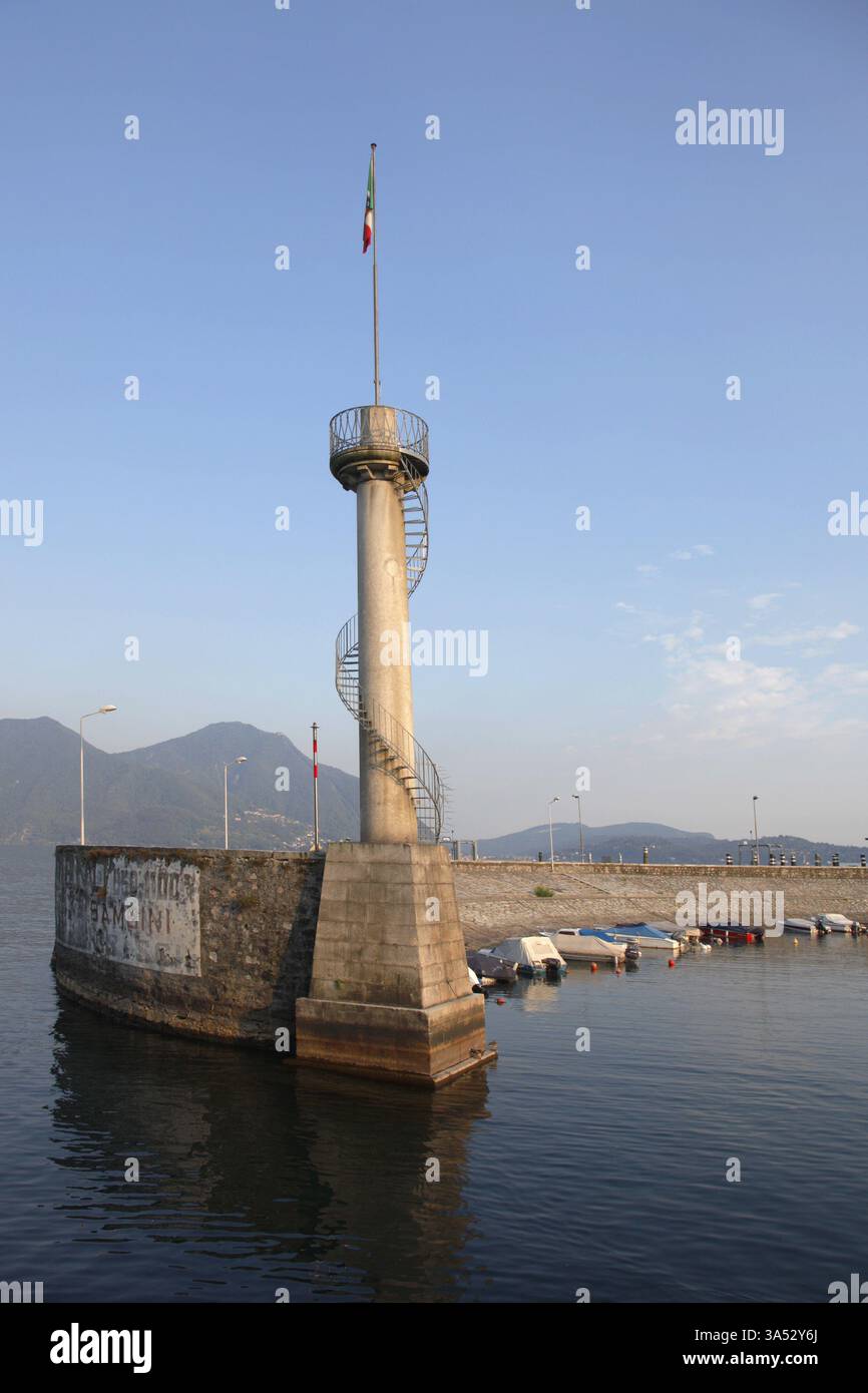 Pier and lighthouse in the port resort town on Lake Maggiore Stock ...