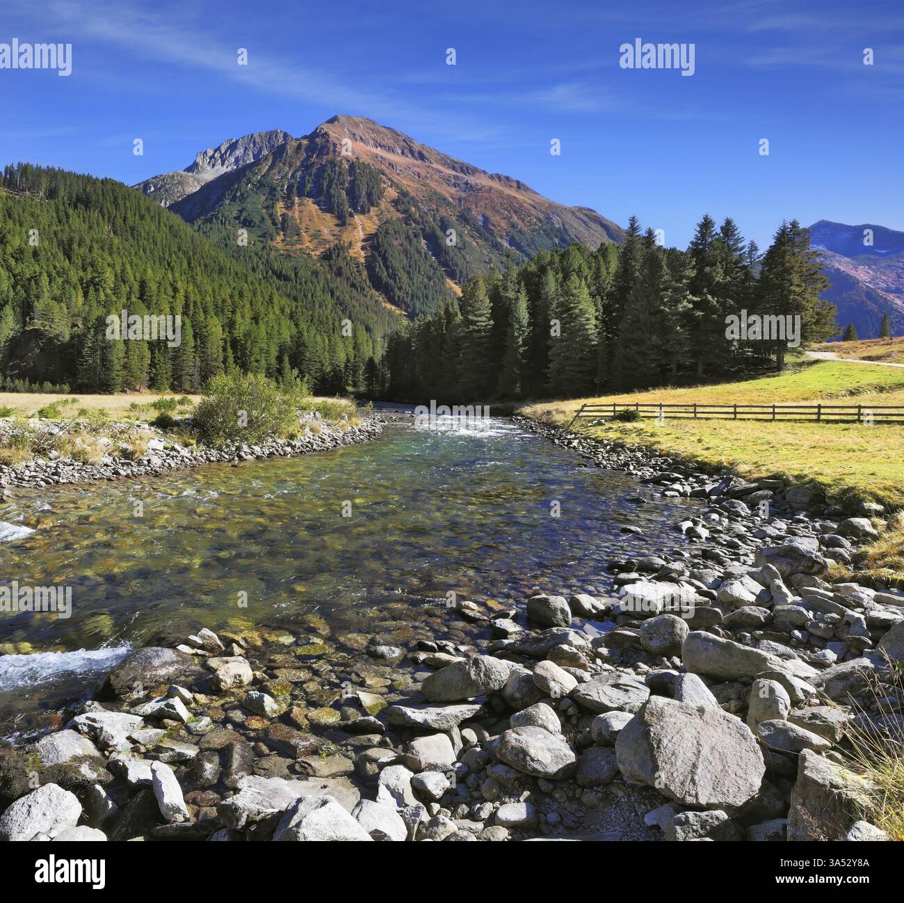 Austrian Alps. Headwaters Krimml waterfalls. The narrow stream flows ...