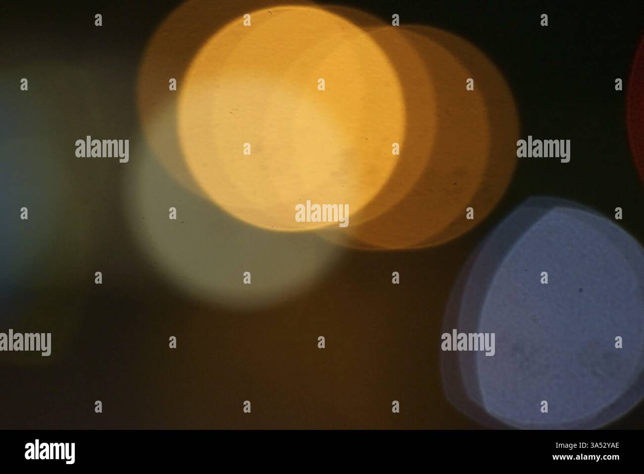 Abstract and blurred light circles of brake lights and night lighting ...