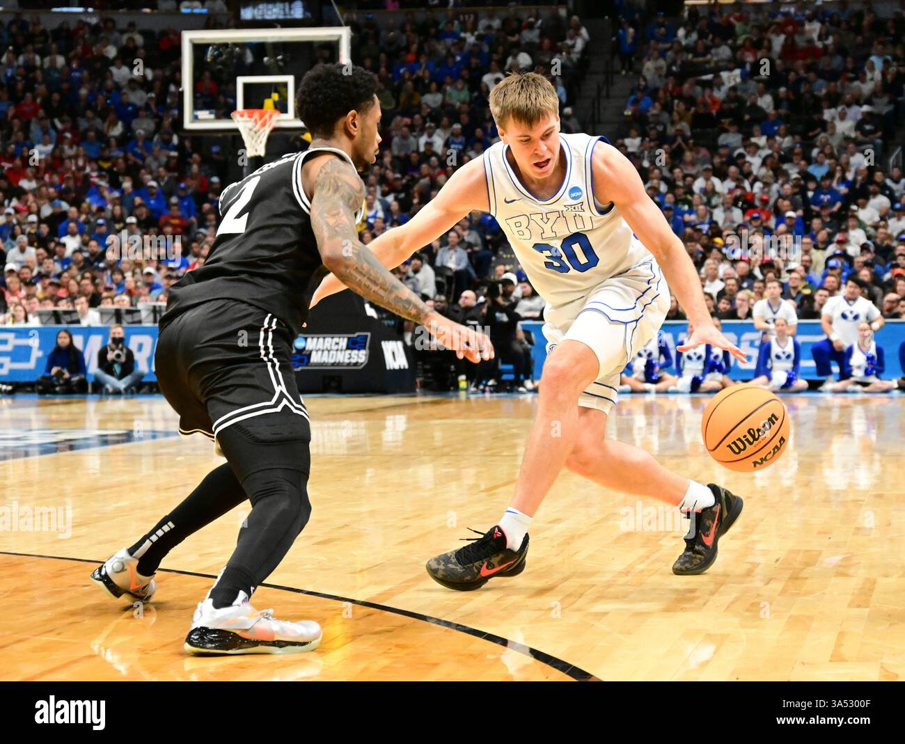 BYU guard Dallin Hall, right, struggles to control the ball as Virginia ...