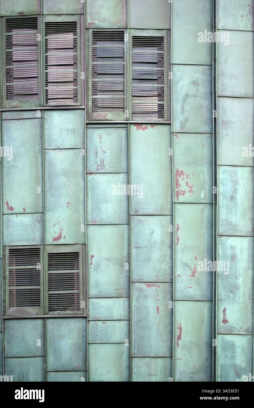 Close-up of the copper sheet panelling of a roof ridge with barred ...
