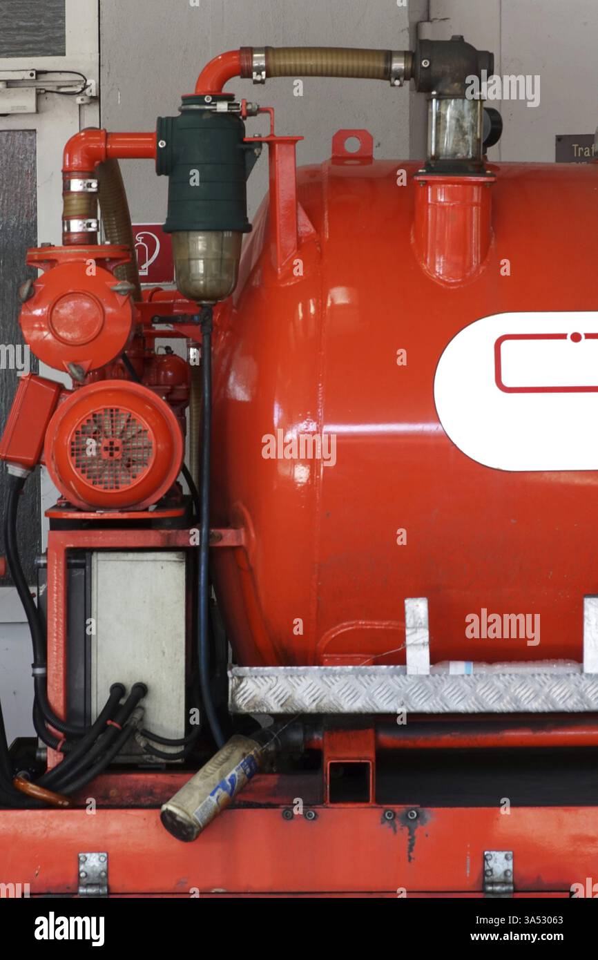 Close-up of the red body and the water tank of a fire engine or small ...