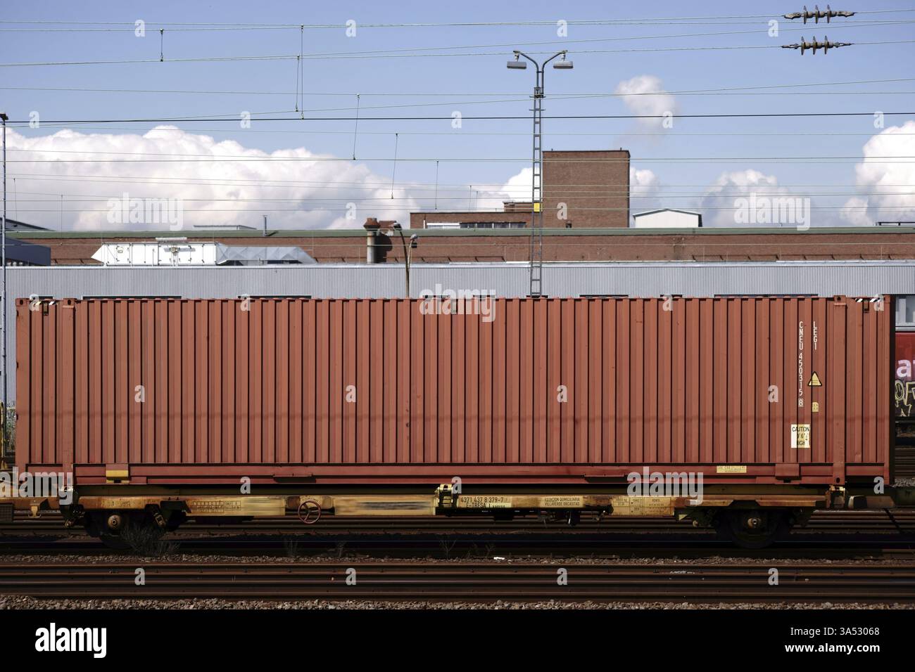 The side view of a railway carriage of a goods train on the platform of ...