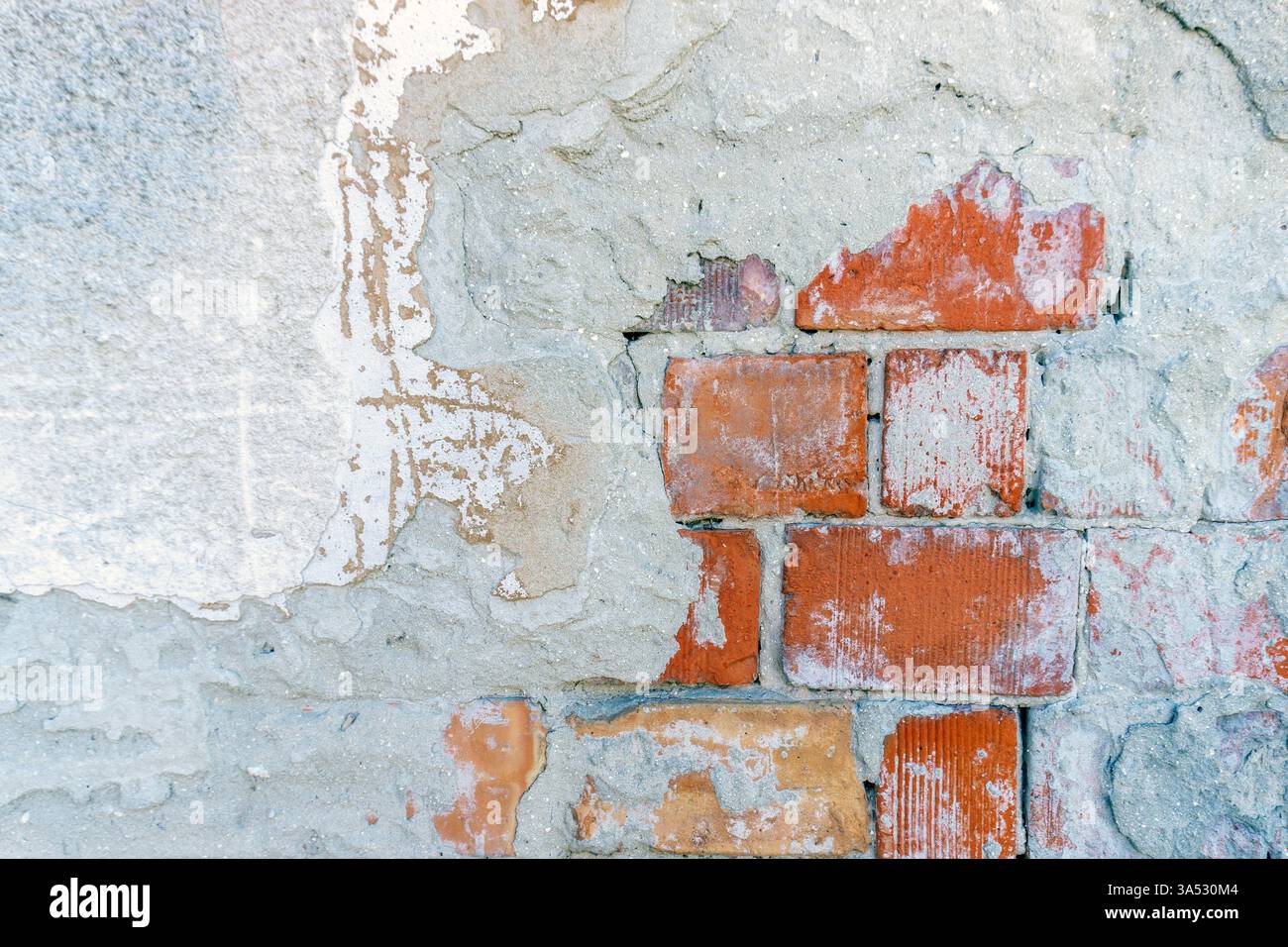 Surface reveals a mix of smooth and rough textures with exposed bricks ...
