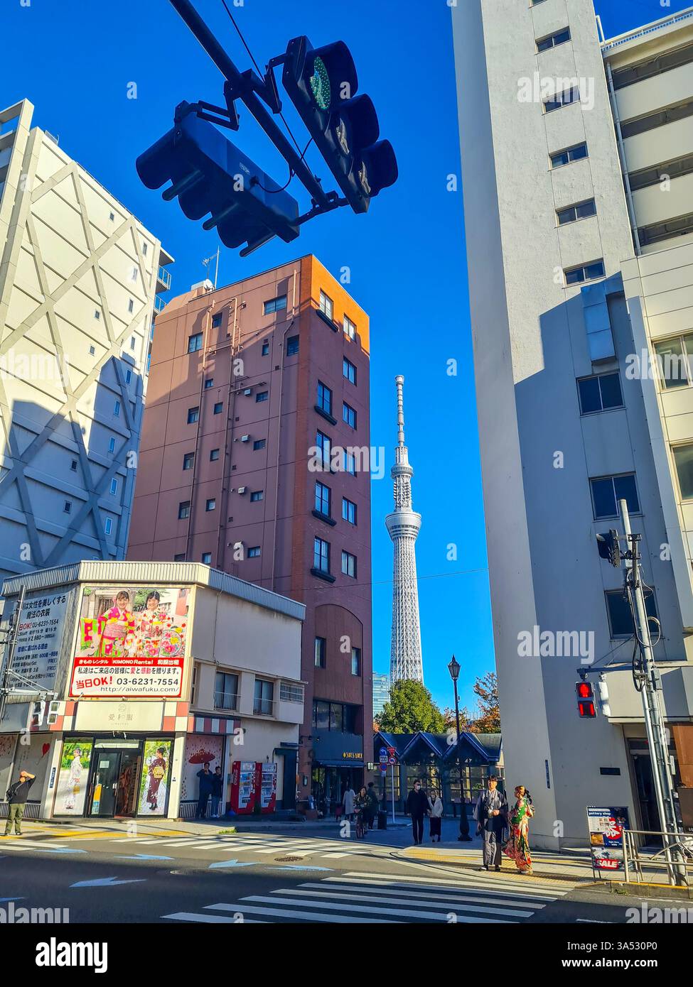 View of Tokyo Skytree with people wearing traditional Japanese kimonos ...