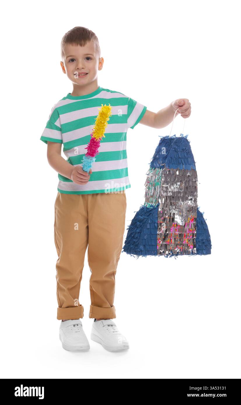 Happy boy with rocket shaped pinata and stick on white background Stock ...