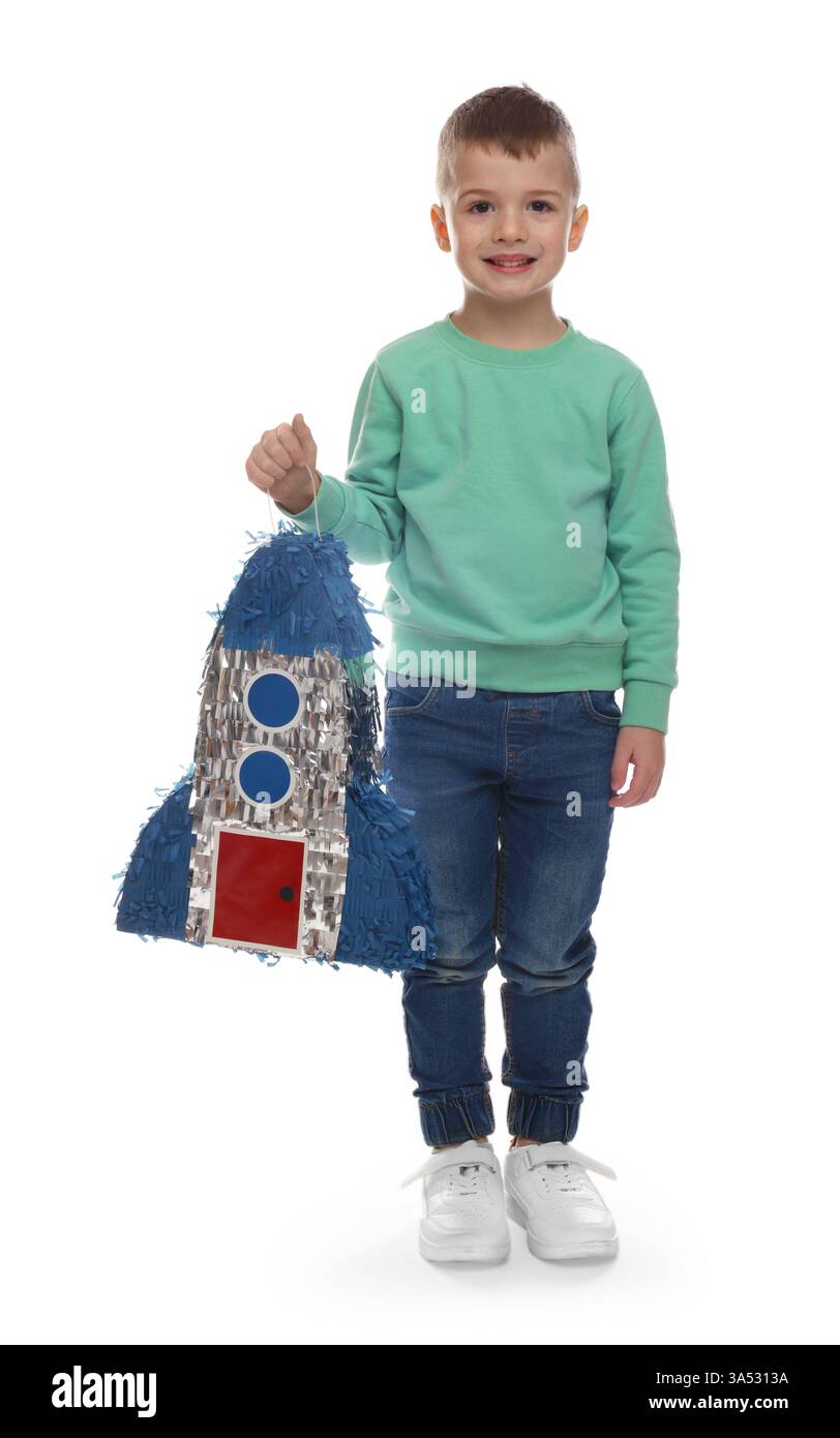 Happy boy with rocket shaped pinata on white background Stock Photo - Alamy