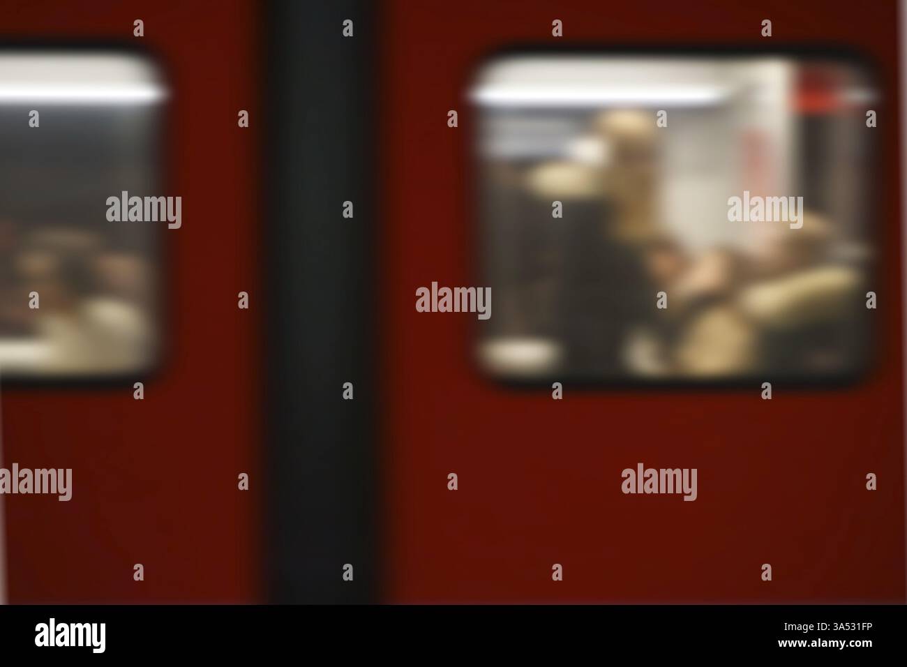 The side view of the body of a passenger train with blurred outlines of ...