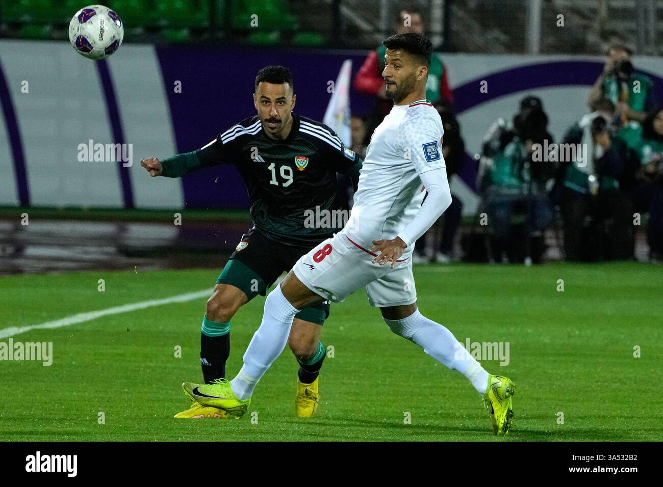 UAE's Khaled Ebraheim Aldhanhani, left, tries to pass Iran's Mohammad ...