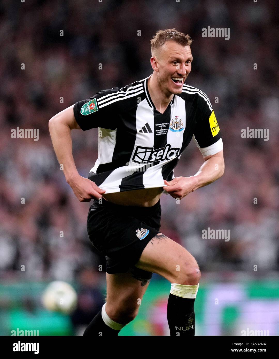 Newcastle United's Dan Burn celebrates victory at the final whistle ...