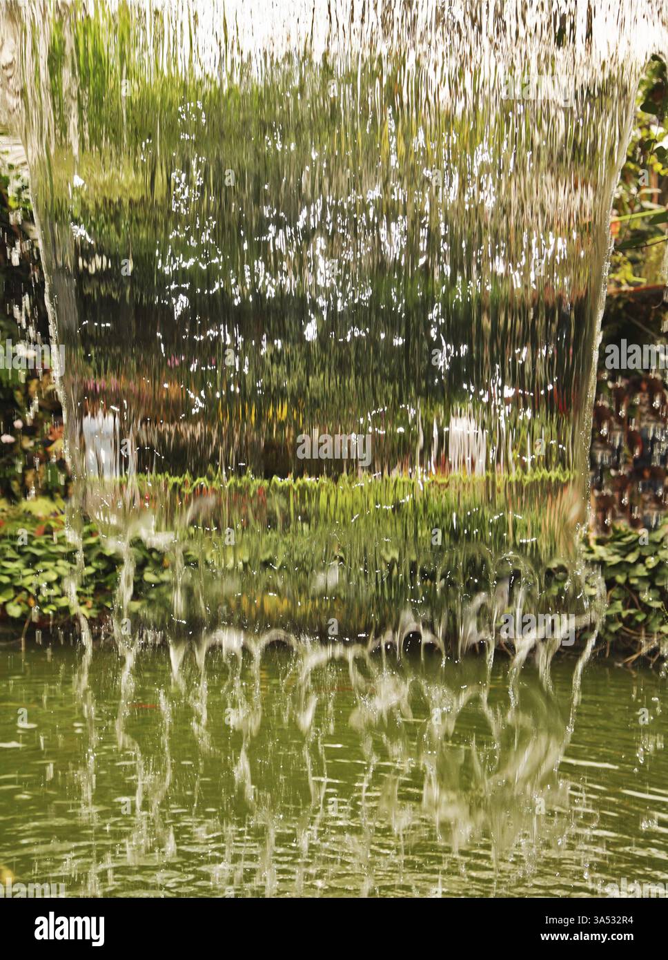 Magnificent decorative waterfalls in tropical park Stock Photo - Alamy