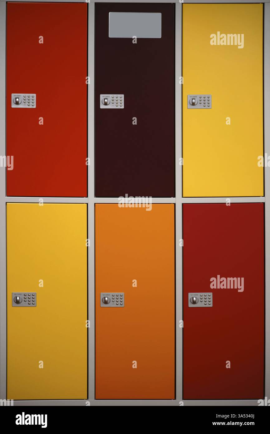 Side-by-side lockers with combination locks in a school building for ...