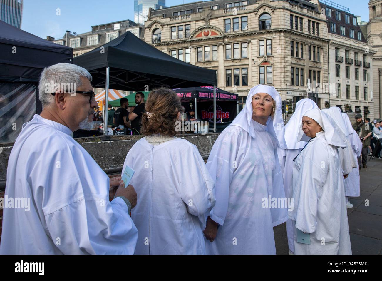 London, UK. 20th Mar, 2025. A druid looks back at the procession as ...