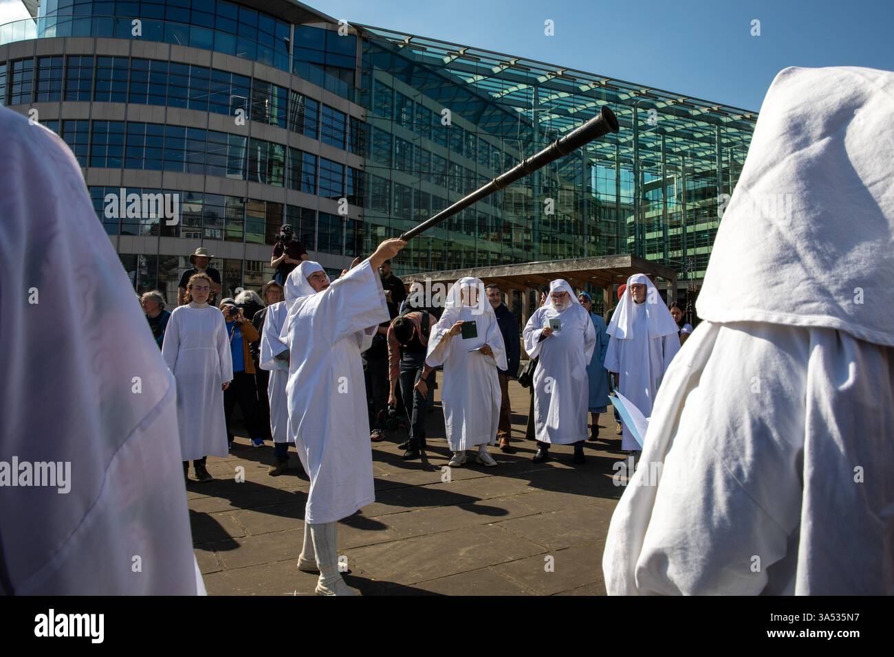 A Druid blows a traditional horn at a spring equinox ceremony. Members ...
