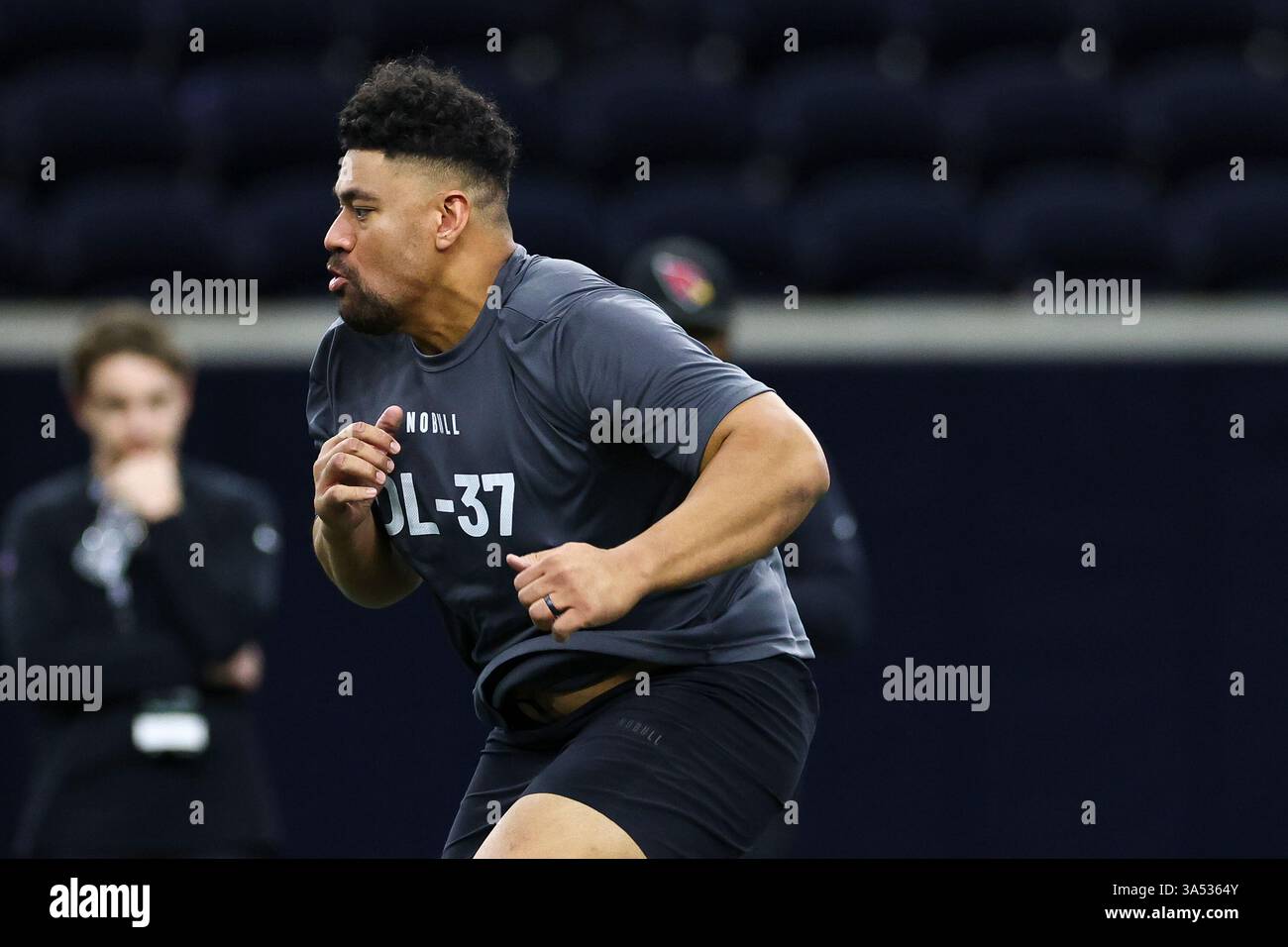 Utah defensive lineman Junior Tafuna runs in a drill during the Big 12 ...