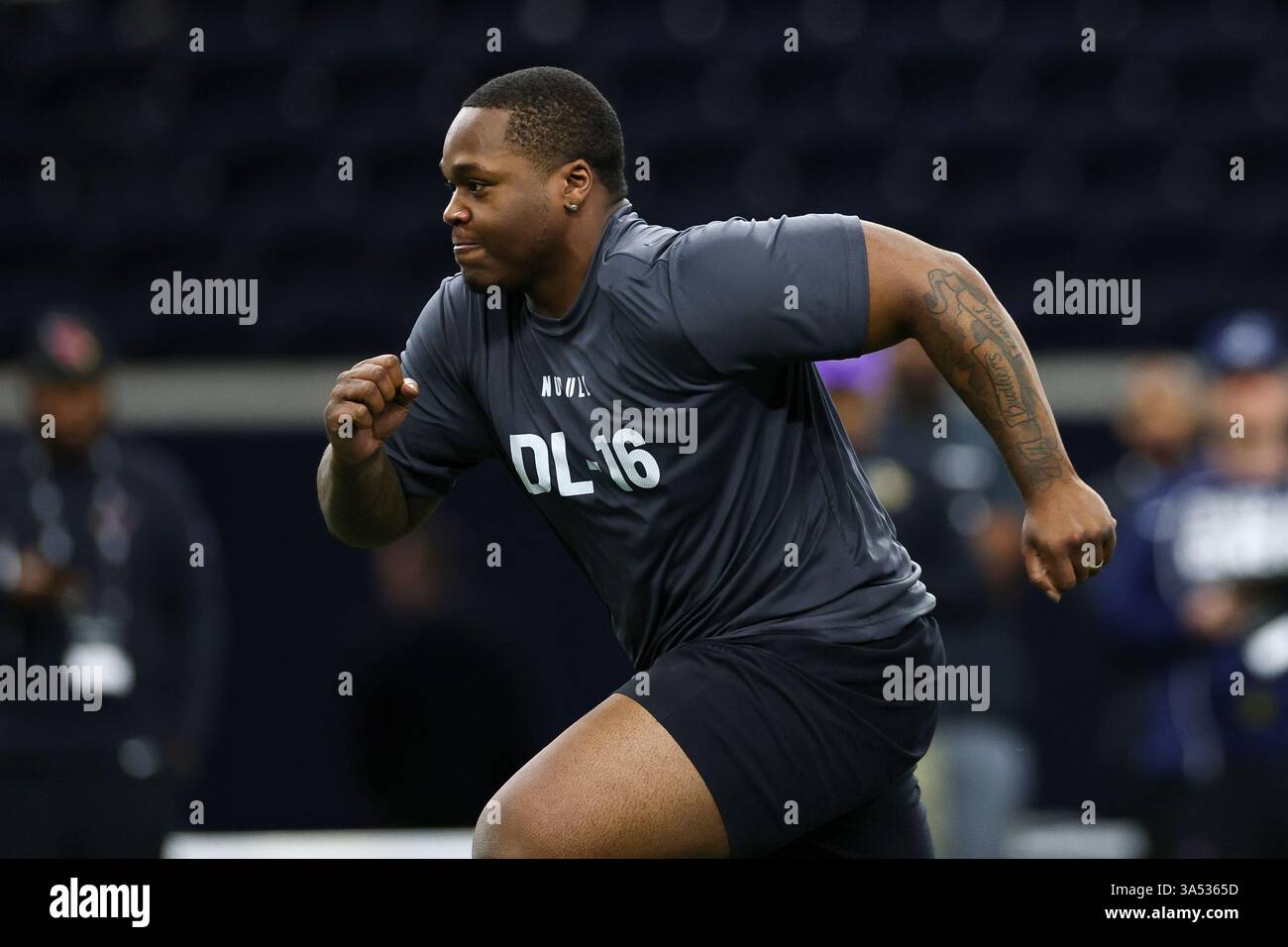 West Virginia defensive lineman TJ Jackson runs in a drill during the ...