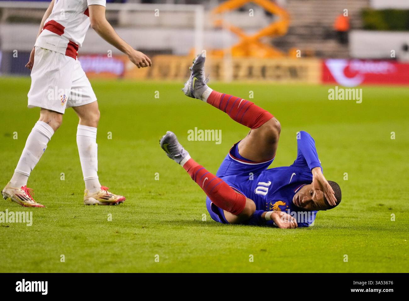 France's Kylian Mbappe falls during the UEFA Nations League ...