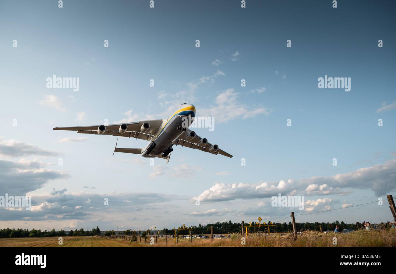 An-225 cargo plane on final approach to airport runway. Front three ...
