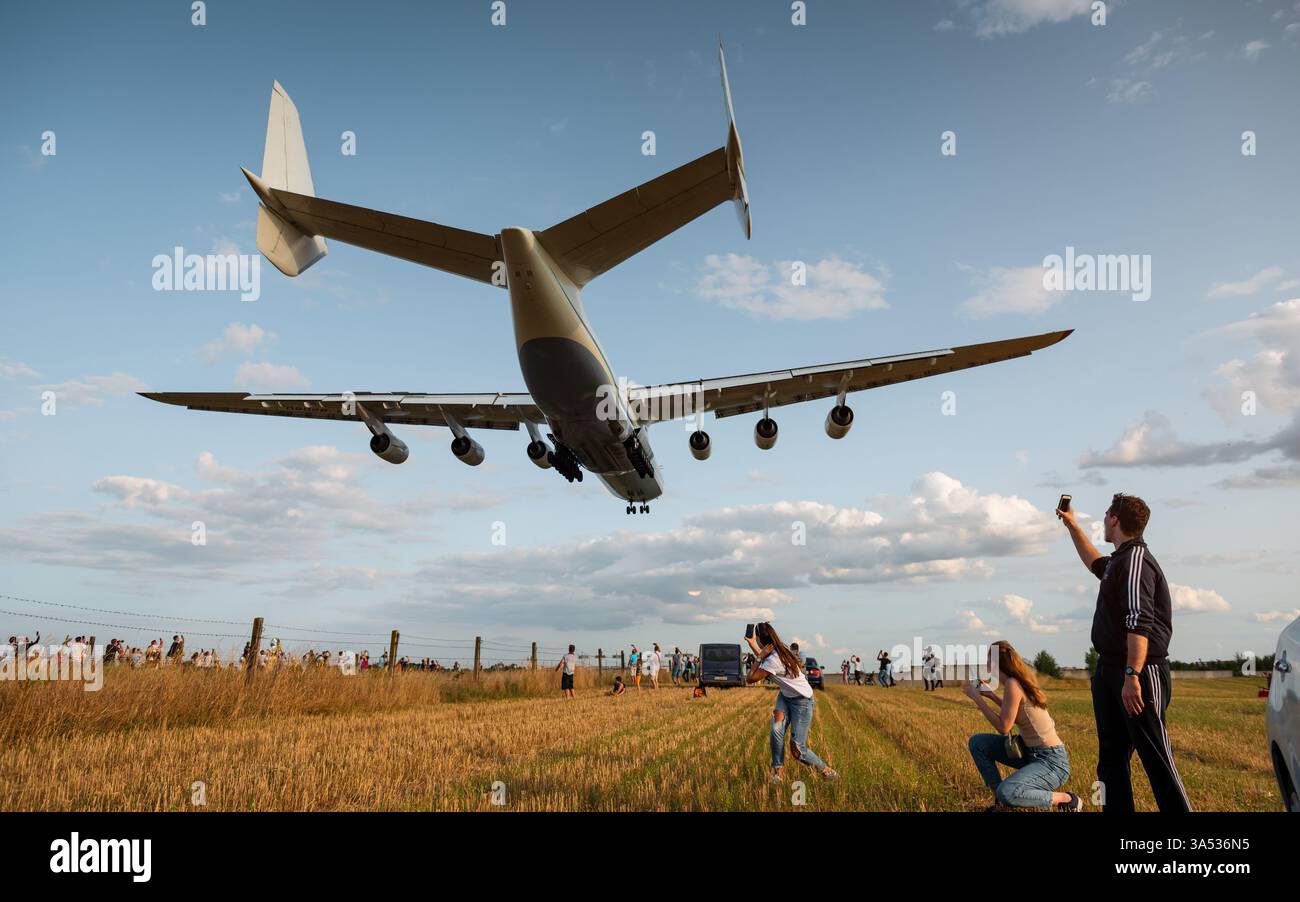 An-225 cargo plane on final approach to airport runway. Rear three ...