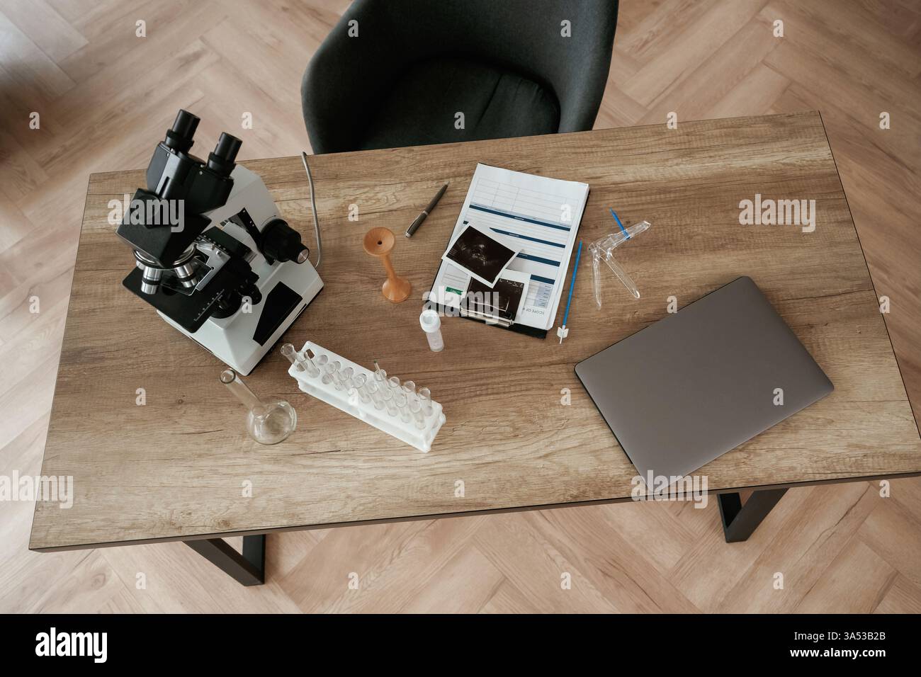 Microscope and laptop. Doctor's equipment, objects on the table Stock ...