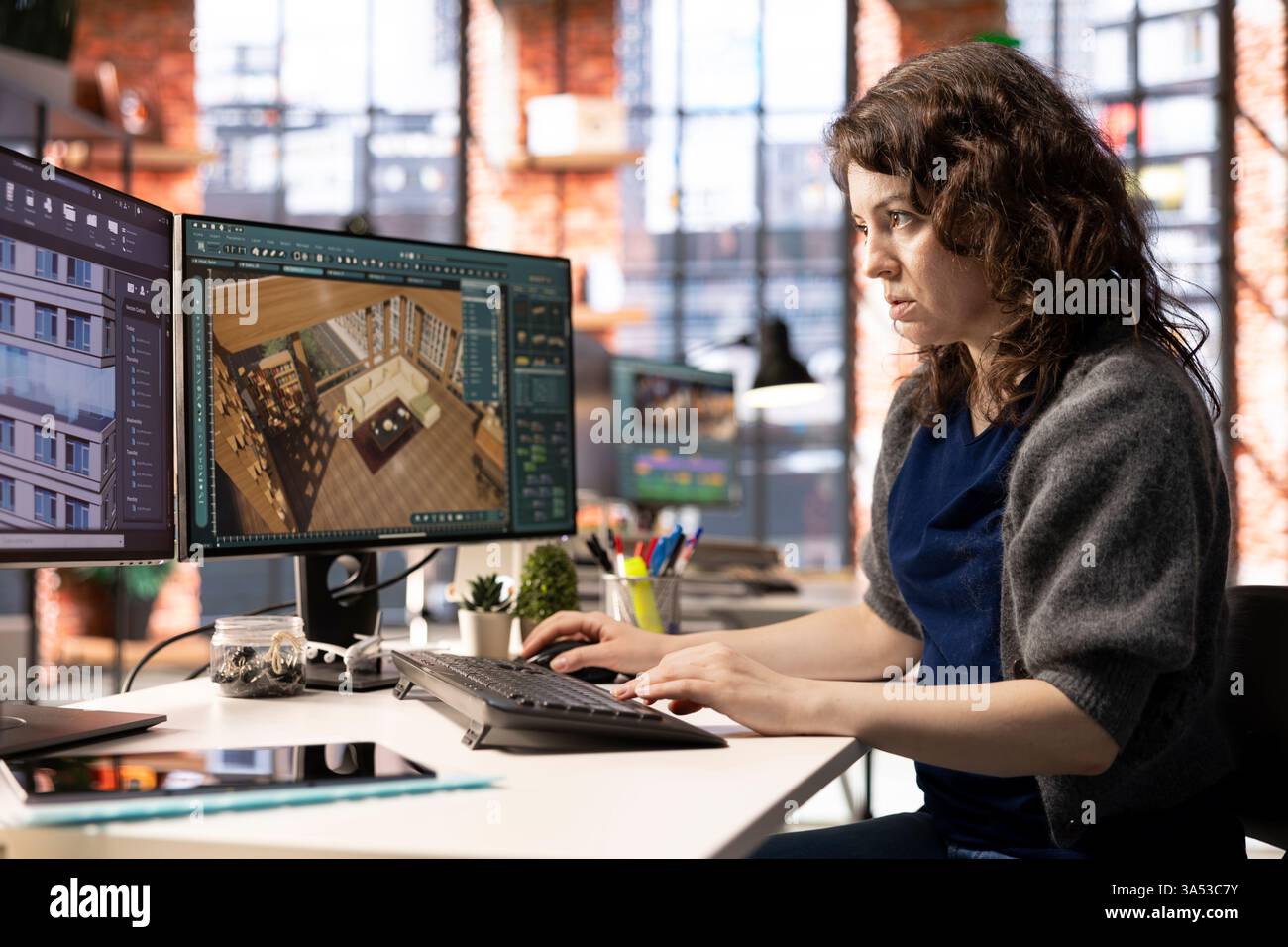 Architectural designer works on a digital home design project, using a ...