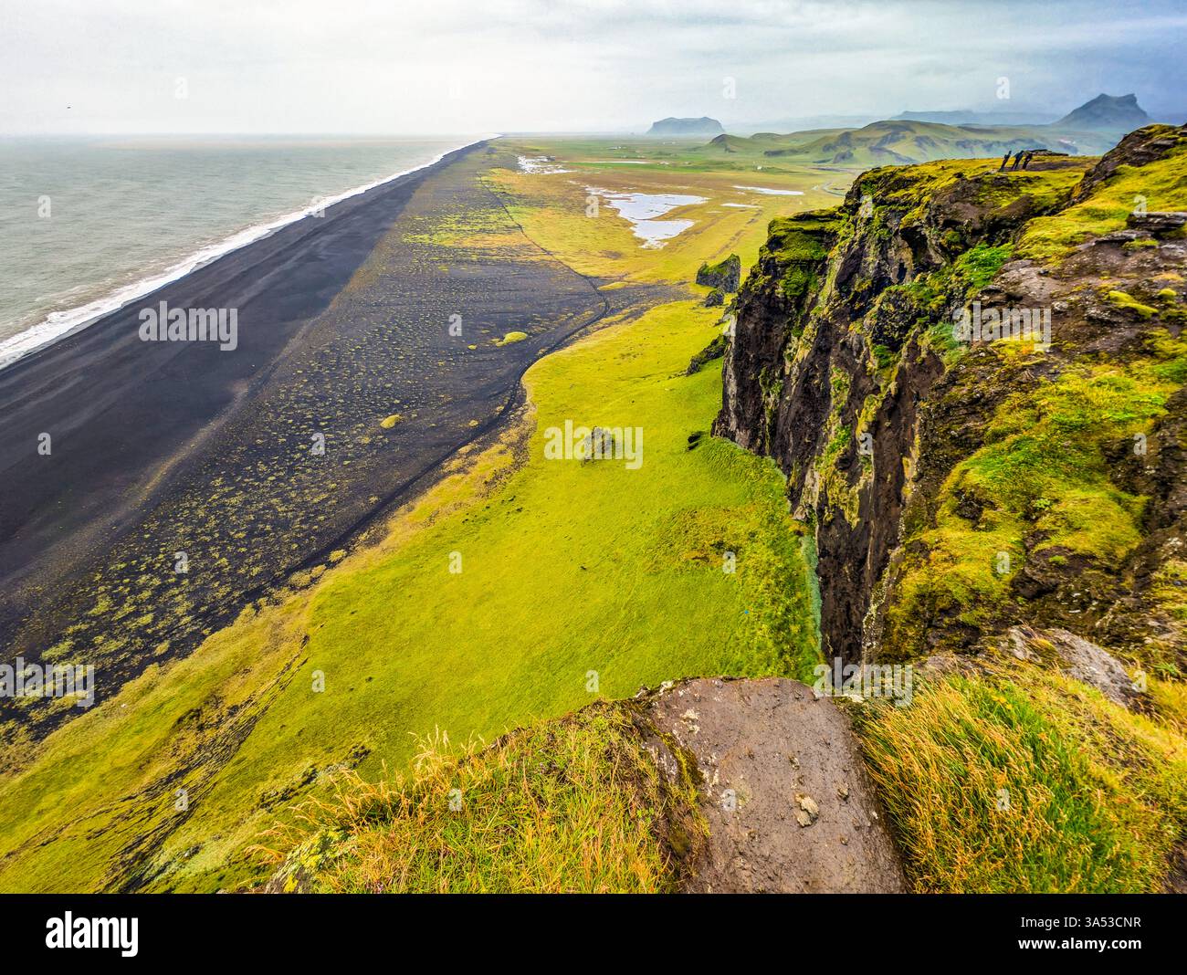 Cliffs of Kirkjufjara black sand beach from Dyrholaey on Atlantic South ...
