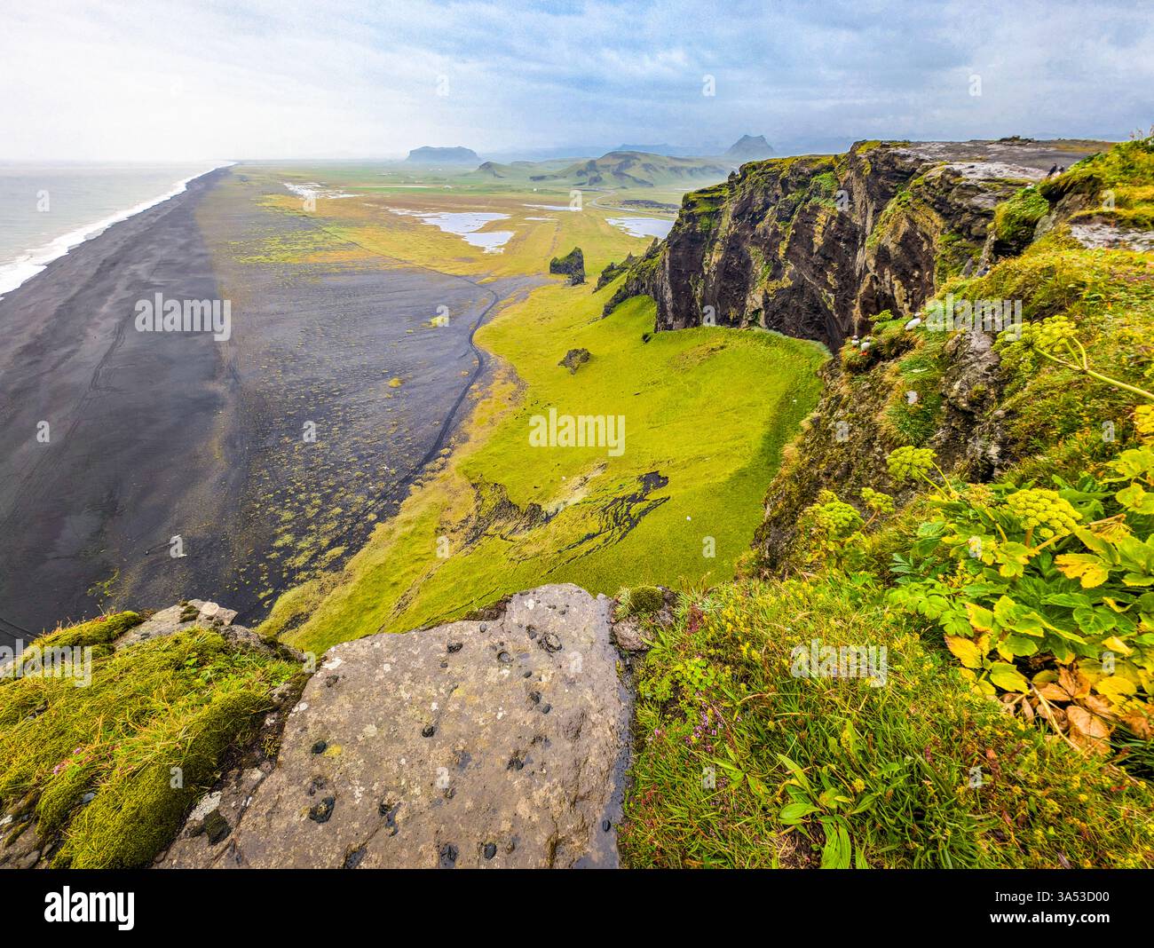 Cliffs of Kirkjufjara black sand beach from Dyrholaey on Atlantic South ...